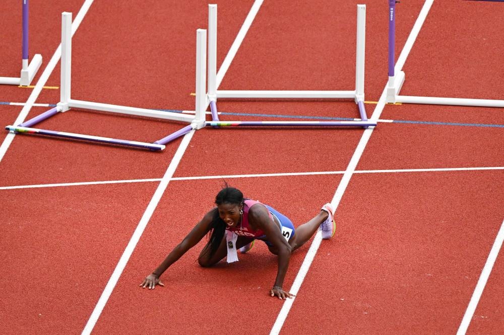 Defending champion Ali crashes out of world 100m hurdles | Malay Mail