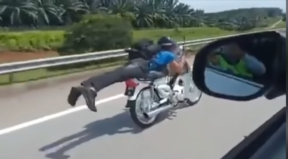 Video of Malaysian teen performing motorbike stunts and crashing while ...