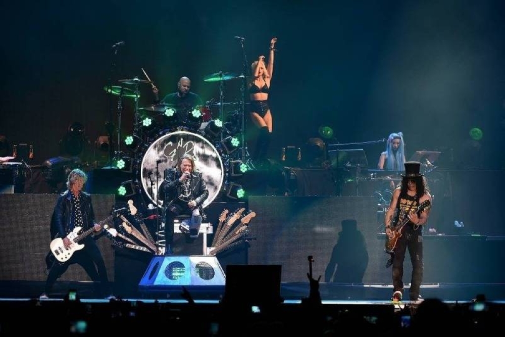 Guns N' Roses to stop throwing mic at fans after device hit a ...