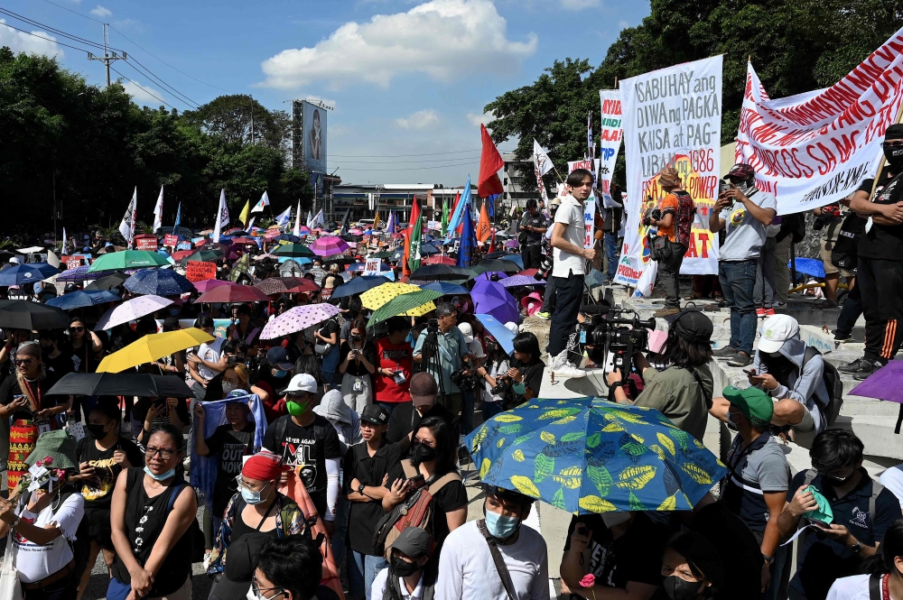Philippine protesters celebrate 'People Power' ousting of Marcos Sr ...