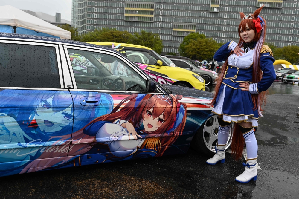Japan’s ‘cringeworthy’ cartoon cars make image U-turn | Malay Mail
