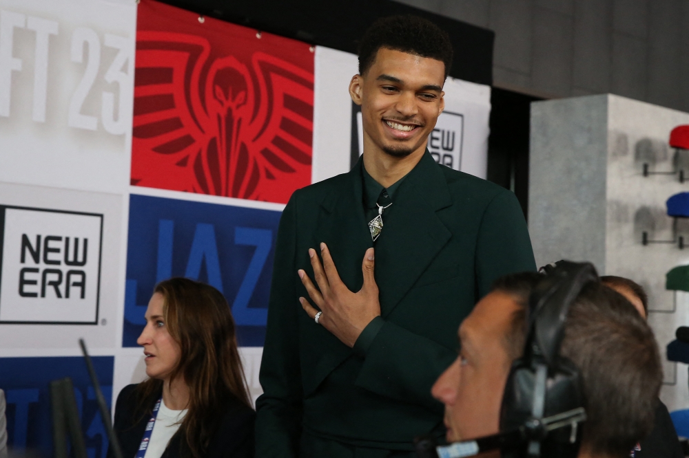 Giant cut-out, prayer candles as 'Wemby-mania' grips San Antonio ...