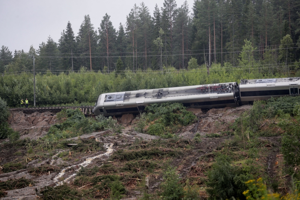 Train derails and roads flood as Sweden, Norway hit by torrential rain ...