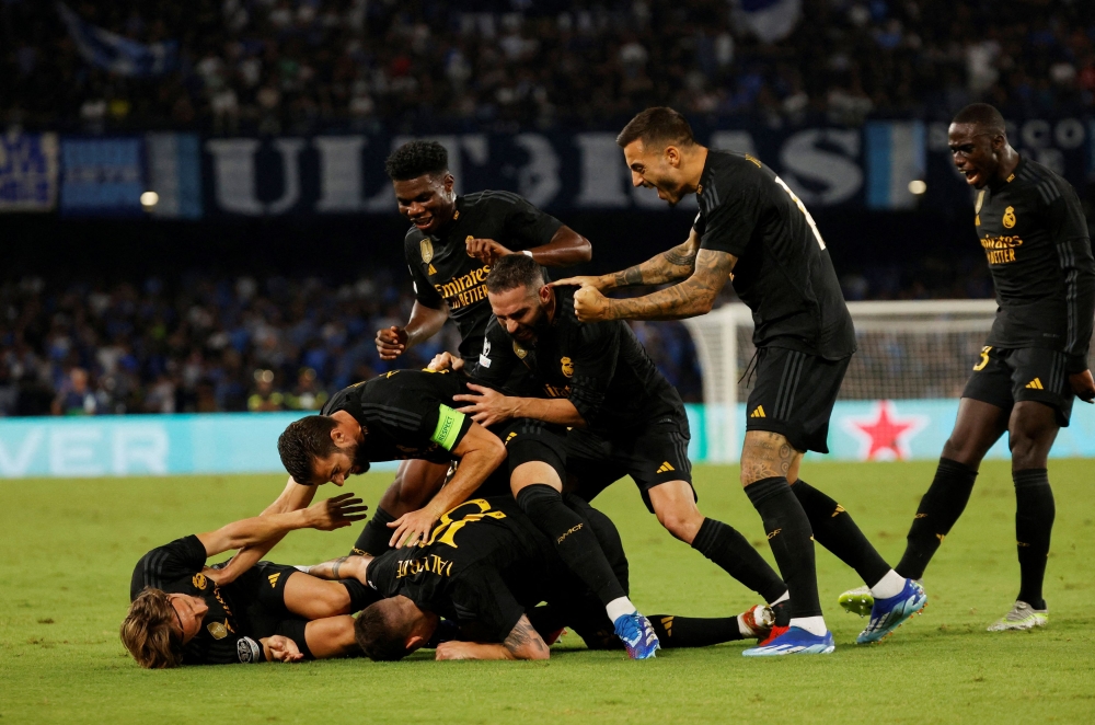 Real Madrid fight back to win five-goal thriller at Napoli | Malay Mail