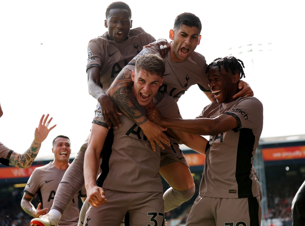 Ten-man Spurs top Premier League as Van de Ven sinks Luton | Malay Mail