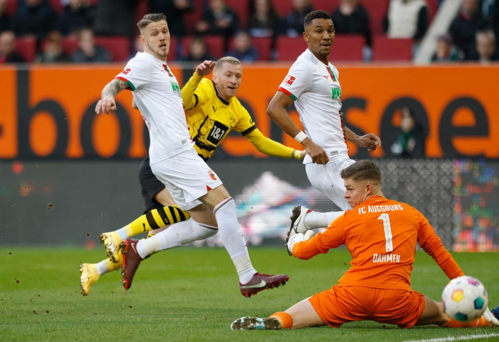 Dortmund’s poor run continues with draw at Augsburg, Leipzig win ...