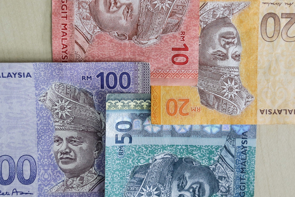 Ringgit opens lower against stronger US dollar | Malay Mail