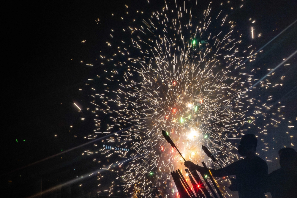 Macau’s firecracker free-for-all sparks joy for New Year celebrants ...