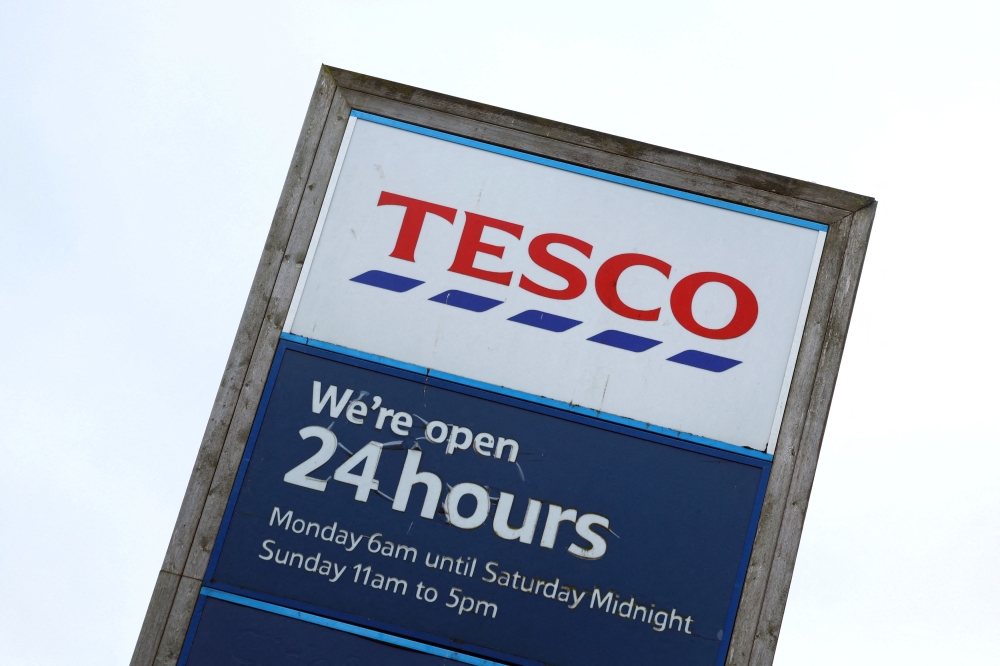 UK's Tesco forecasts profit rise after building 'strong momentum ...