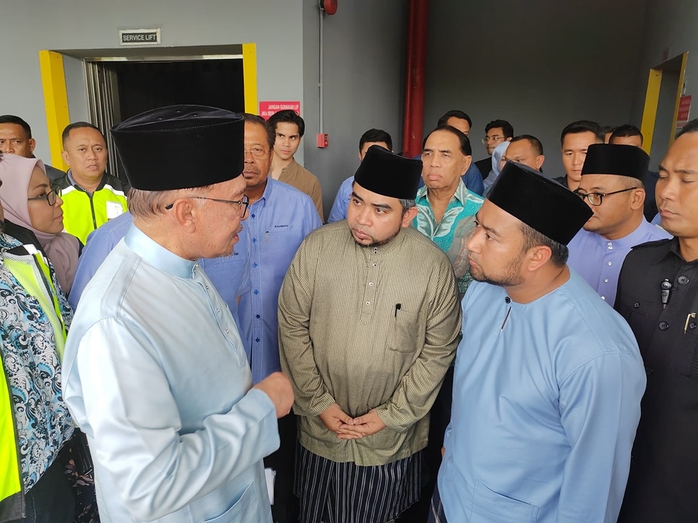 PM Anwar relieved aid group CEO reunited with family after being ...