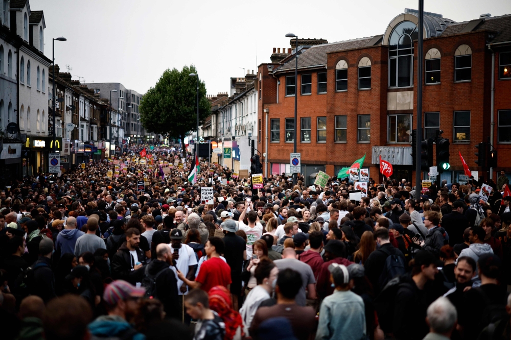 Cheers, claps as anti-racism protesters flood north-east London ...