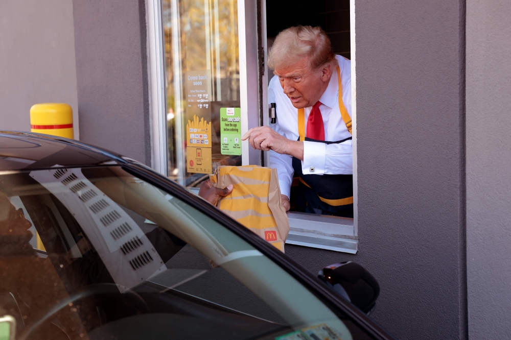 ‘I love salt!’ Trump dons apron to serve french fries at McDonald’s, in ...