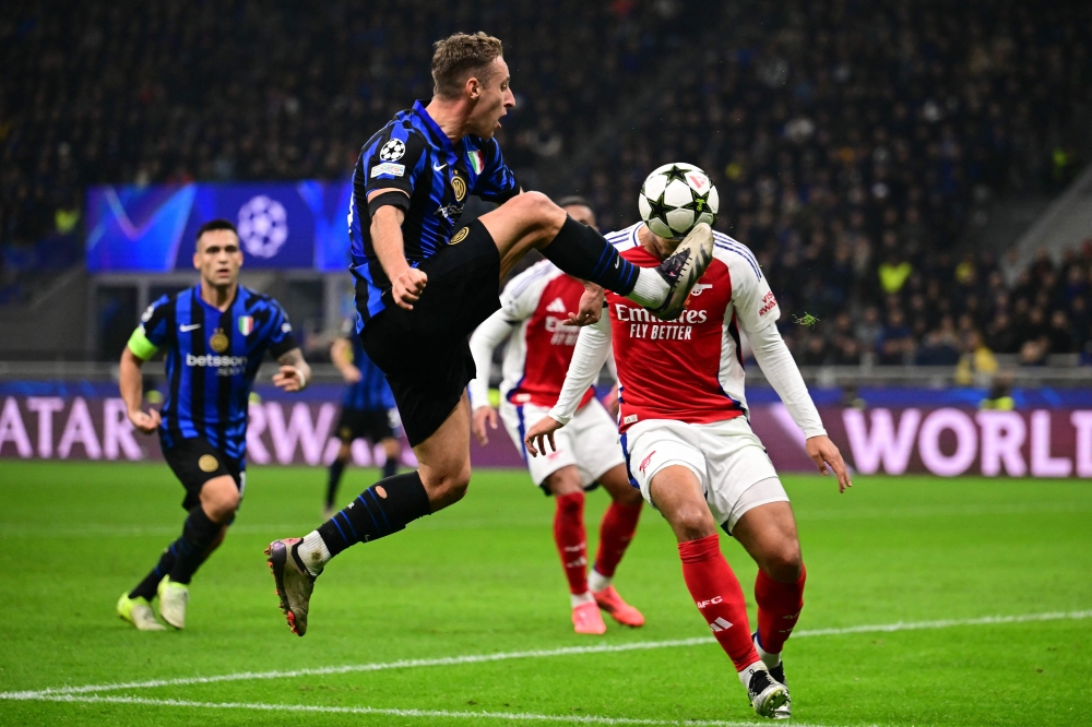 Calhanoglu’s penalty lifts Inter over Arsenal, Atletico stuns PSG in ...