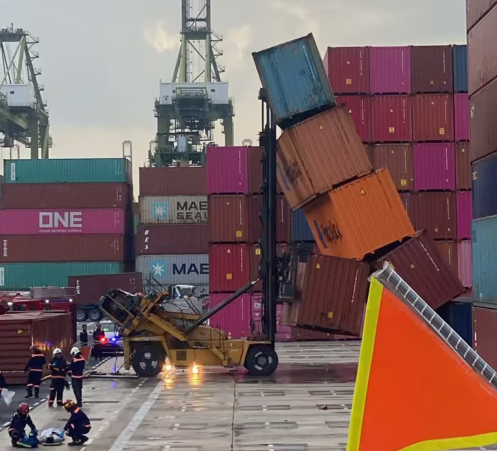 Malaysian forklift operator injured in container collapse at Singapore ...