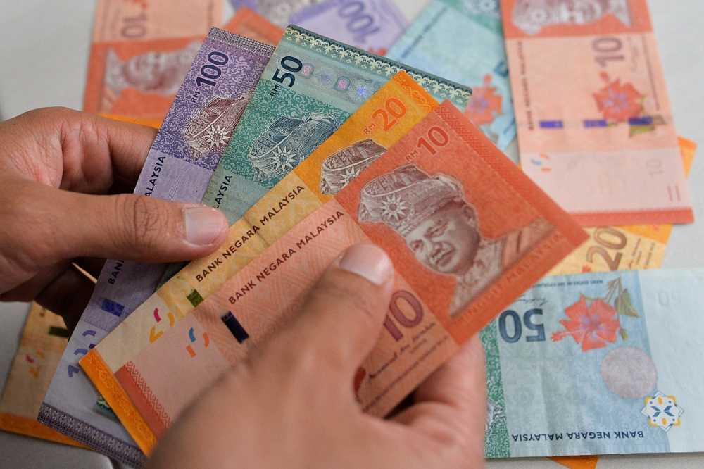 Ringgit climbs as US Fed dials down the hawkish talk | Malay Mail