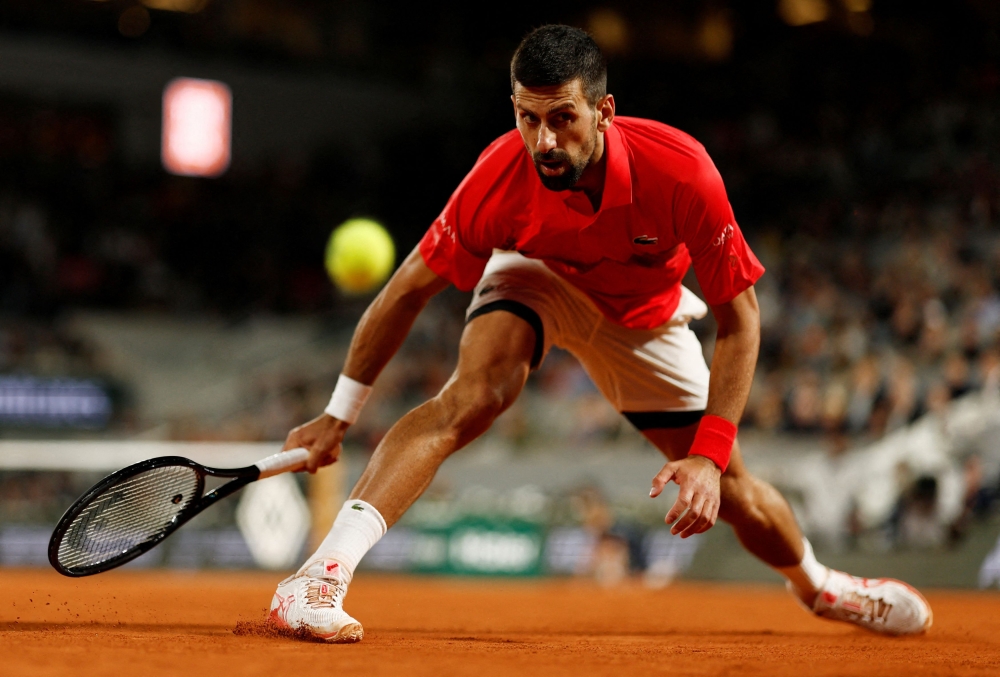 Djokovic turns to drop shot magic in testing French Open win | Malay Mail