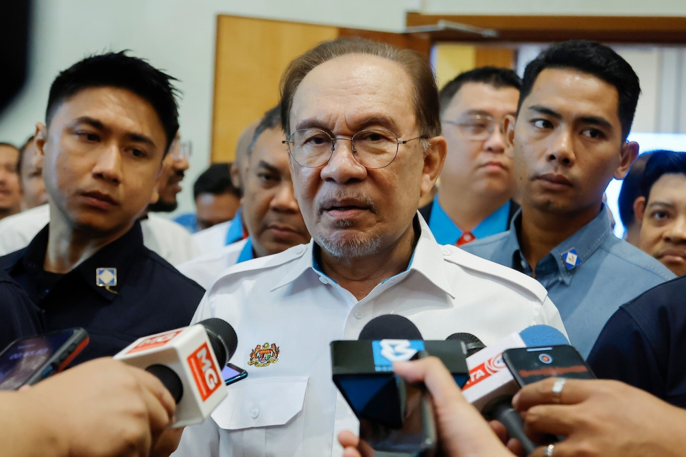 Anwar urges Malaysians to judge govt and its policies on facts, not ...