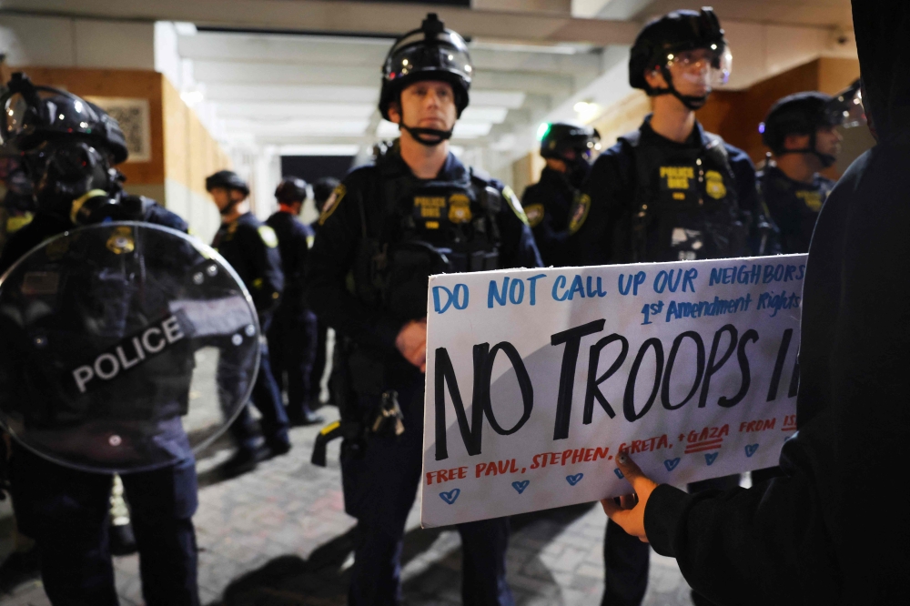 Trump says may invoke Insurrection Act to deploy more troops in US ...