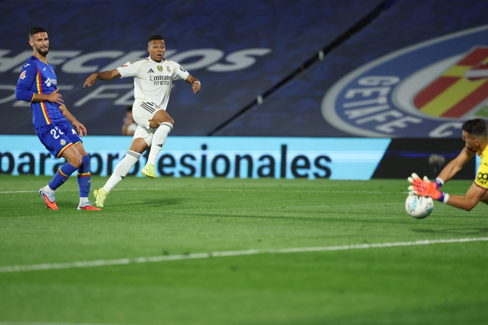 Mbappe fires Real Madrid to La Liga top spot as nine-man Getafe self ...