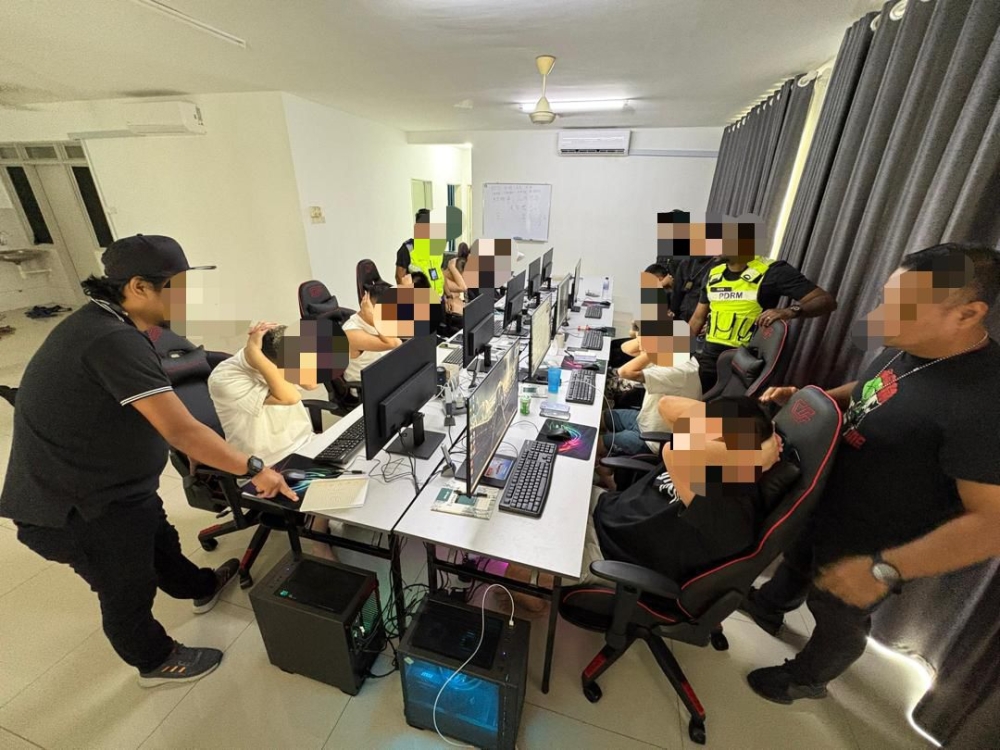 Cops bust eight online scam rings in KL, arrest 52 foreign nationals ...