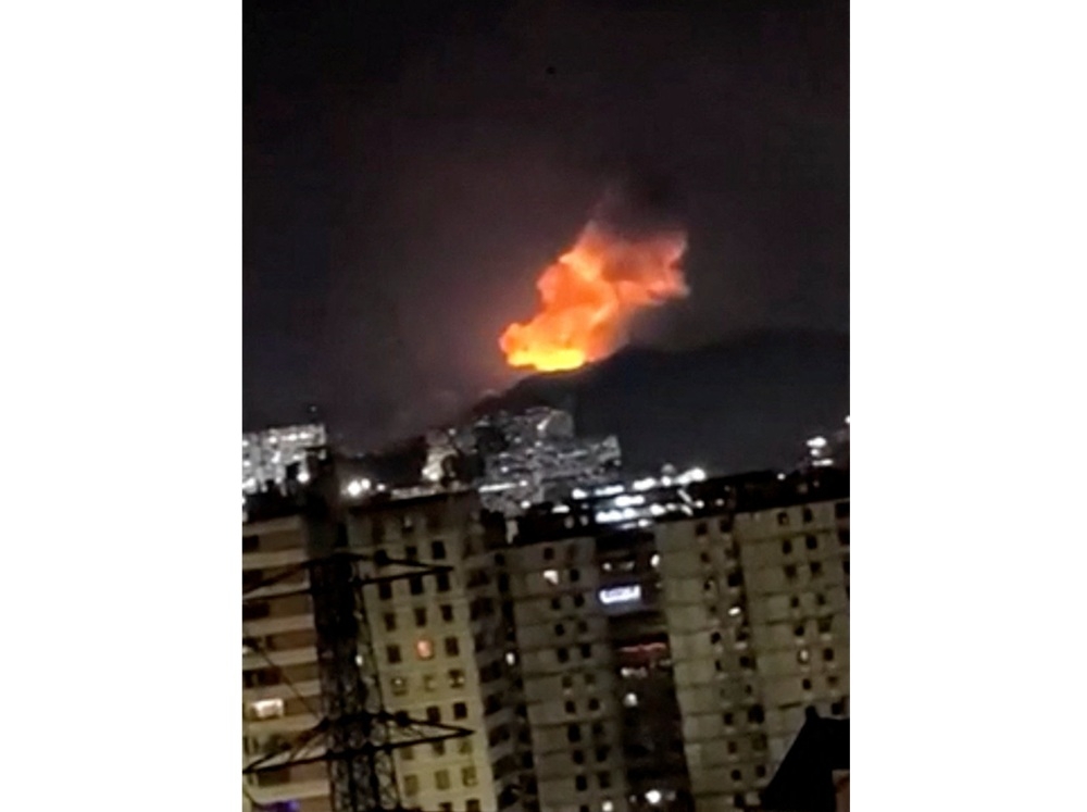 Smoke, loud noises reported in Caracas as power outage hits near ...