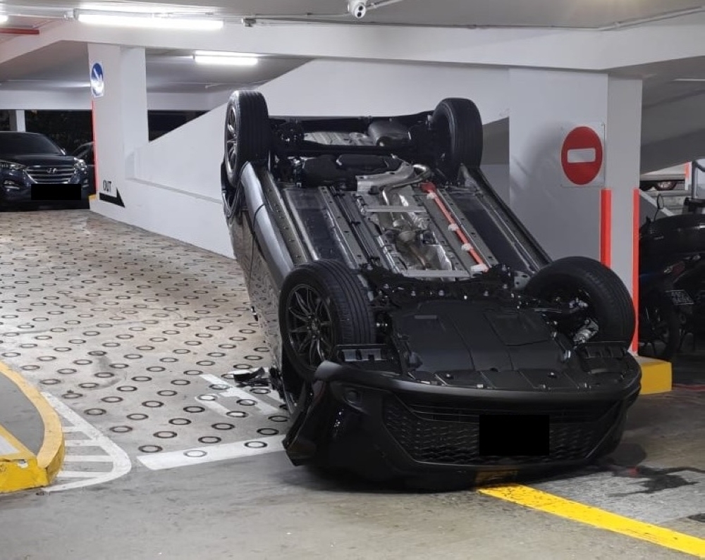 Car overturns in Singapore woodlands carpark; driver suffers minor ...